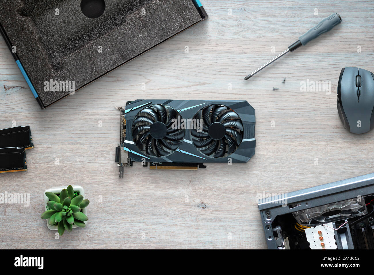 Install graphic card in computer case concept. Top view scene ...