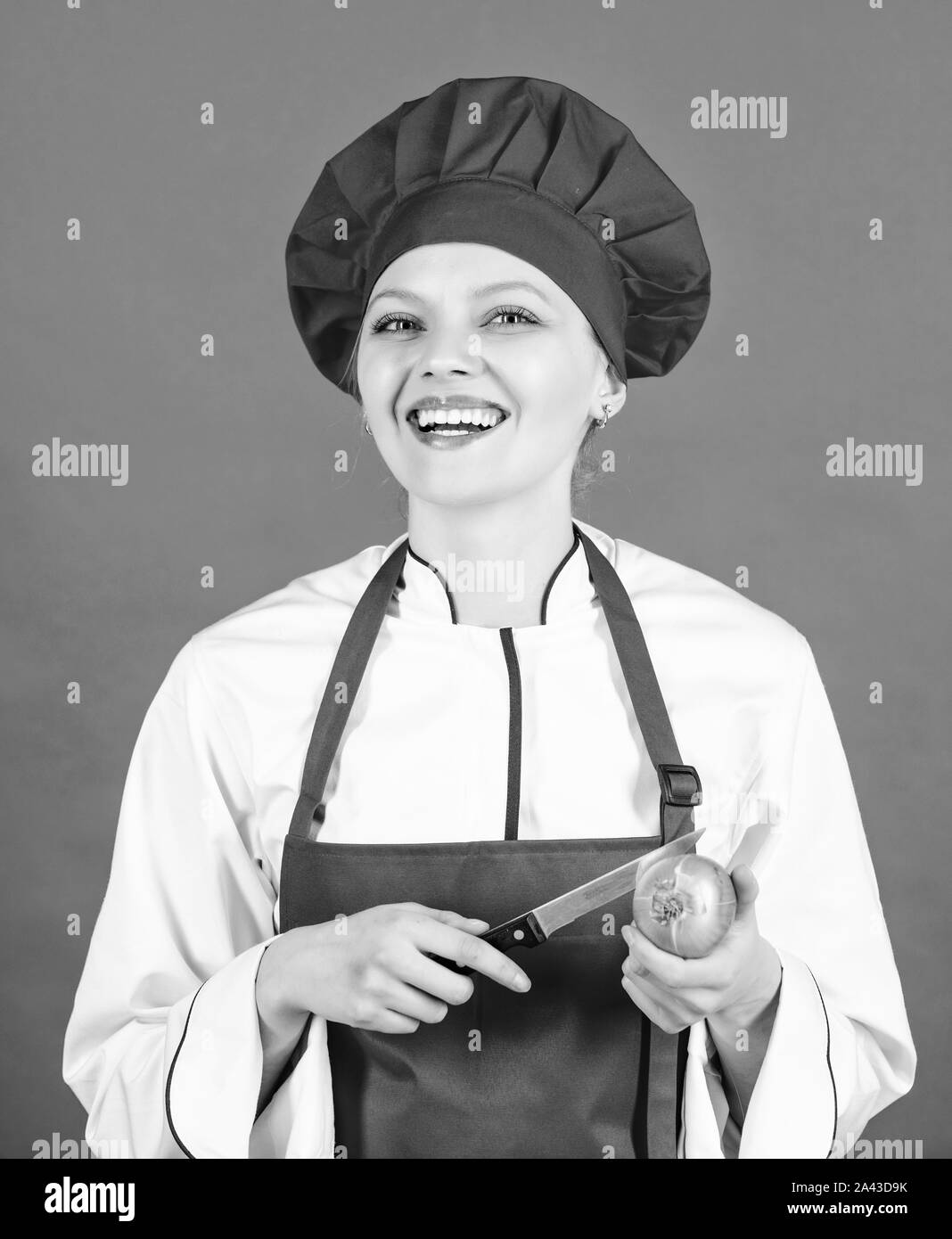 happy woman cooking healthy food by recipe. Housewife with cooking ...