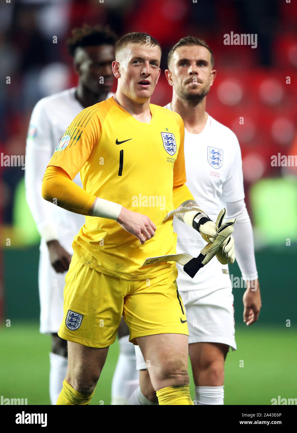 England goalkeeper Jordan Pickford (left) and Jordan Henderson walk off ...