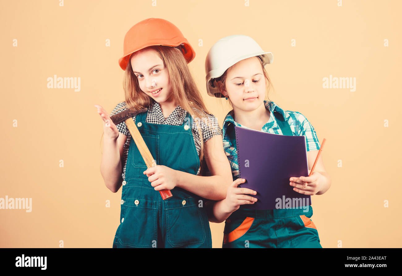 Kids happy renovating home. Home improvement activity. Kids girls with ...