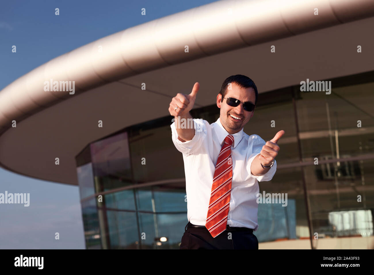 Business person with both thumbs up Stock Photo - Alamy
