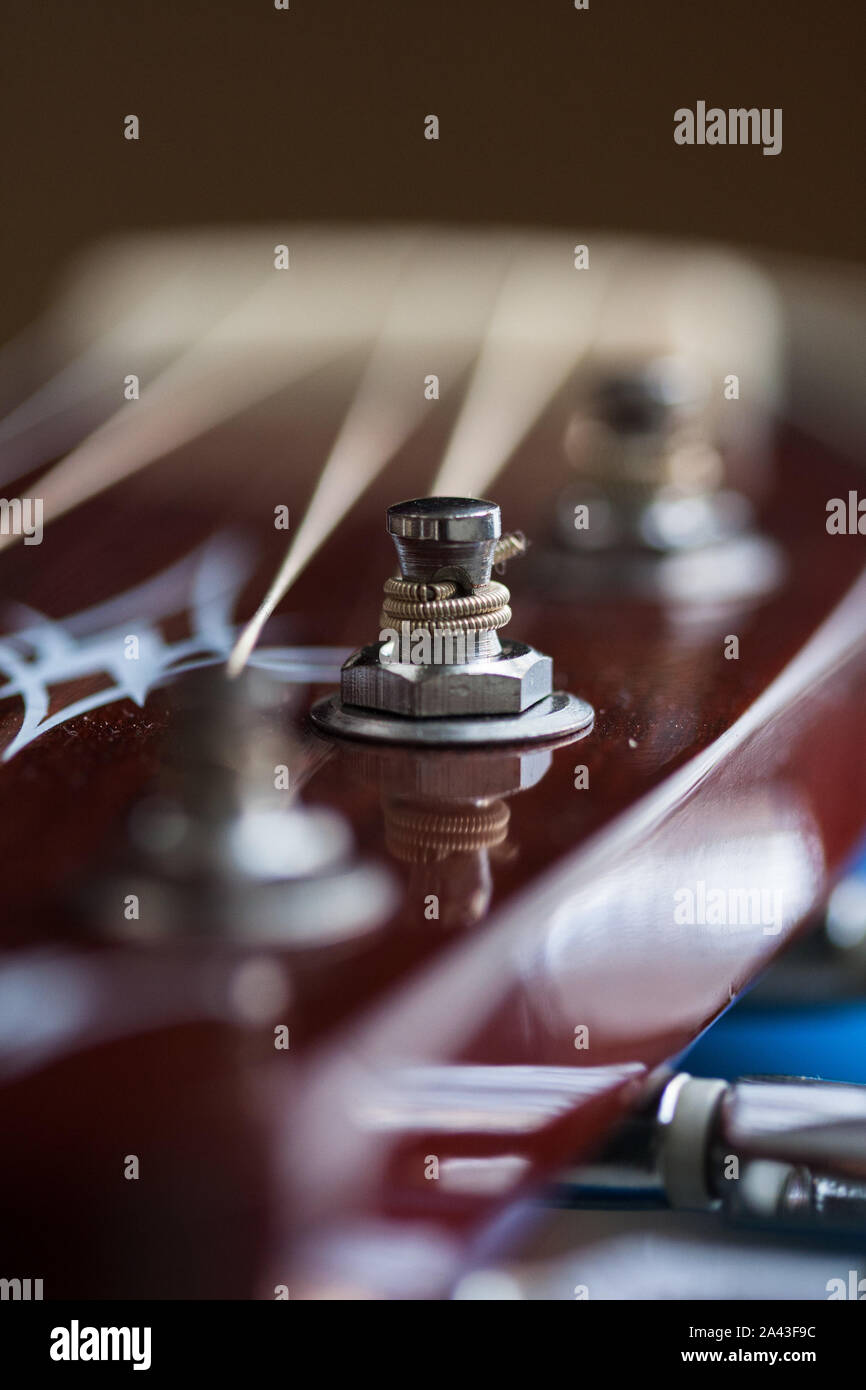 A close up of a guitar tuning peg Stock Photo - Alamy