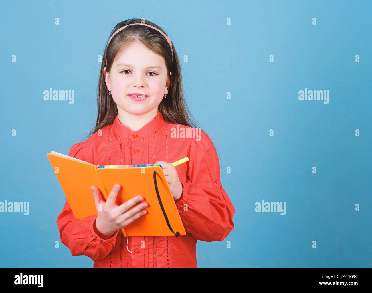 Collecting survey information. Little girl writing notice of ...