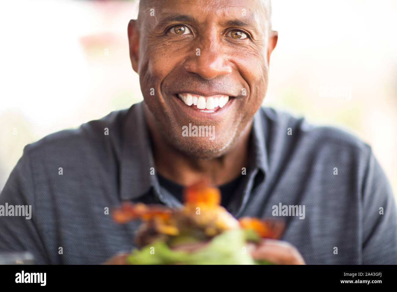 African eating a burger hi-res stock photography and images - Alamy