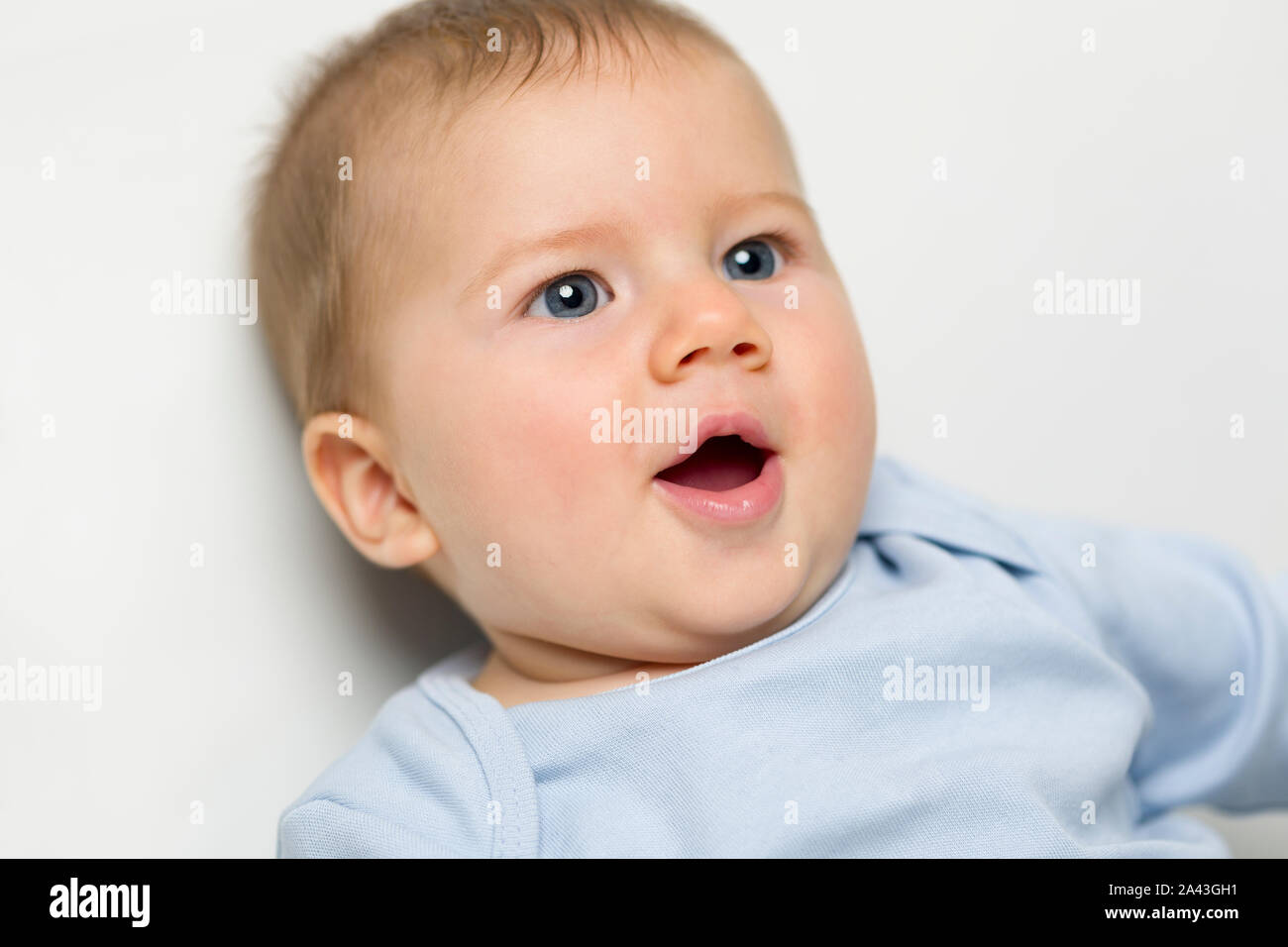 Close up portrait of lovely baby boy with mouth open Stock Photo - Alamy