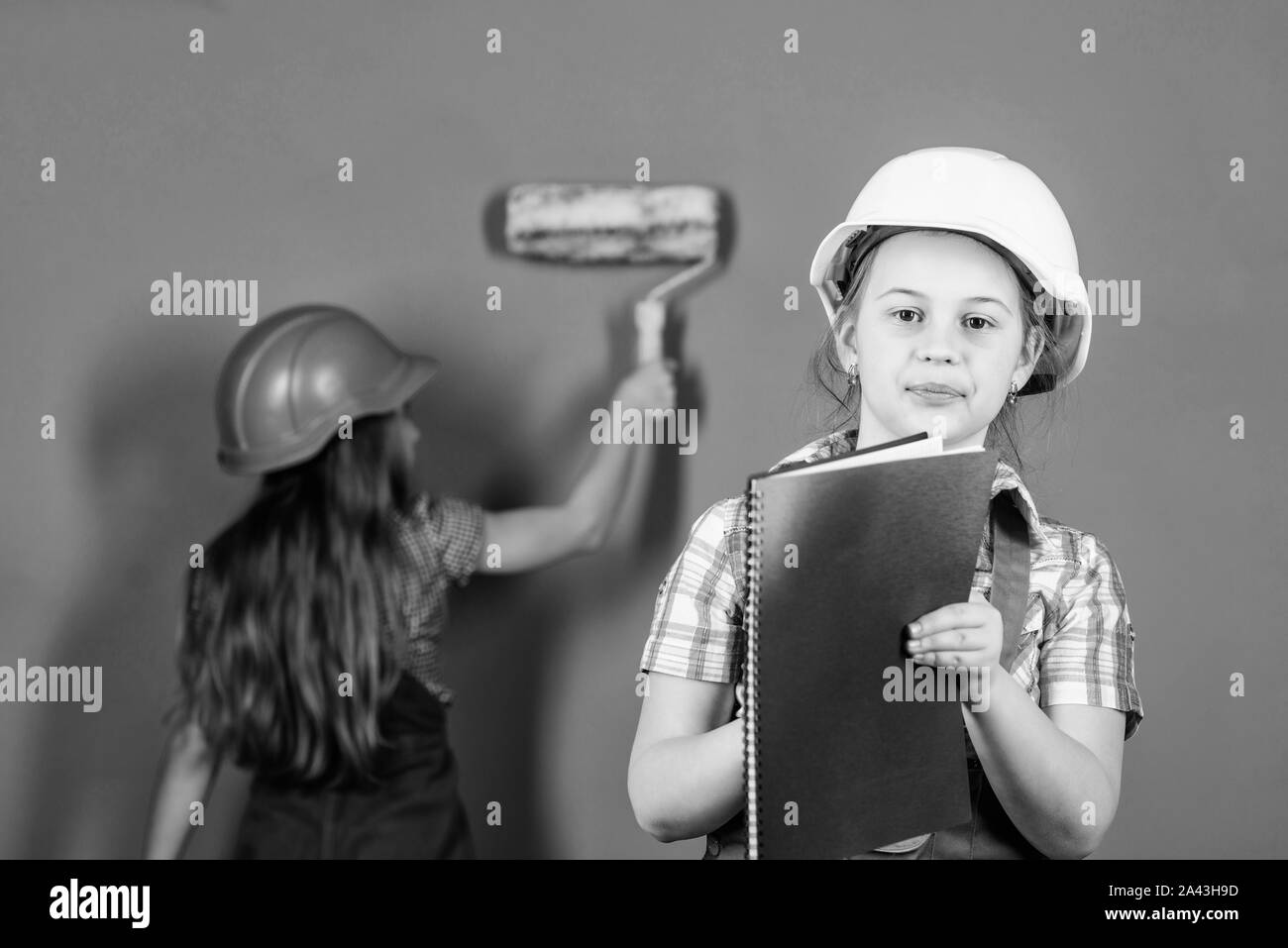 Kids happy renovating home. Repaint walls. Home improvement activity ...