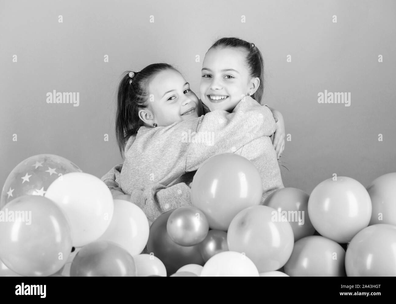Girls best friends near air balloons. Birthday party. Happiness and ...