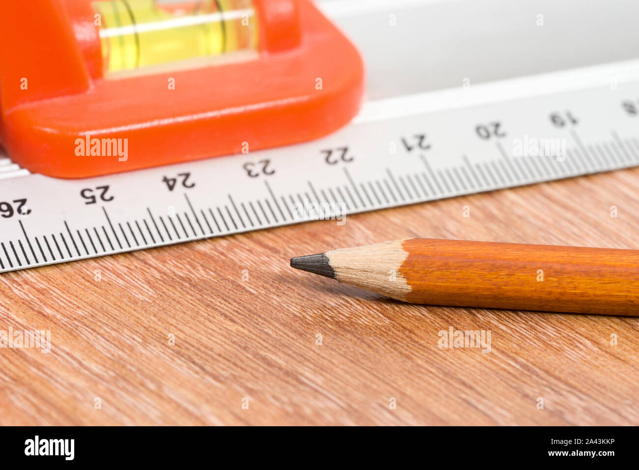 Ruler and pencil repair, laminate flooring installation Stock Photo - Alamy