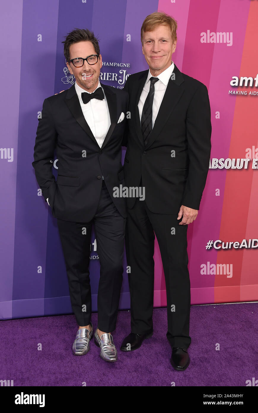 October 10, 2019, Hollywood, California, USA: Dan Bucatinsky and Don Roos arrives for the amFAR ...