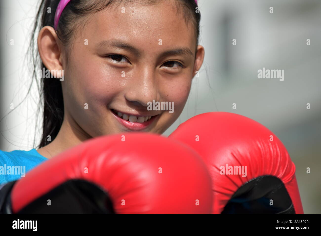 Female Athlete And Happiness Wearing Boxing Gloves Stock Photo - Alamy