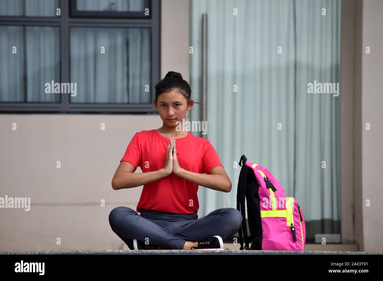 Youthful Girl Student In Prayer Sitting Stock Photo - Alamy