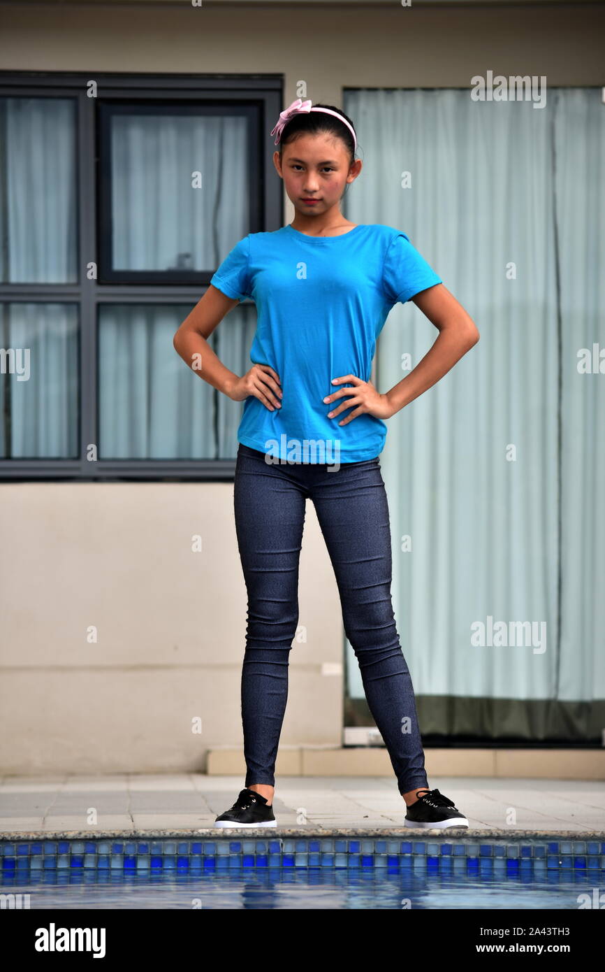 Posing Filipina Person Standing By Condo Stock Photo - Alamy