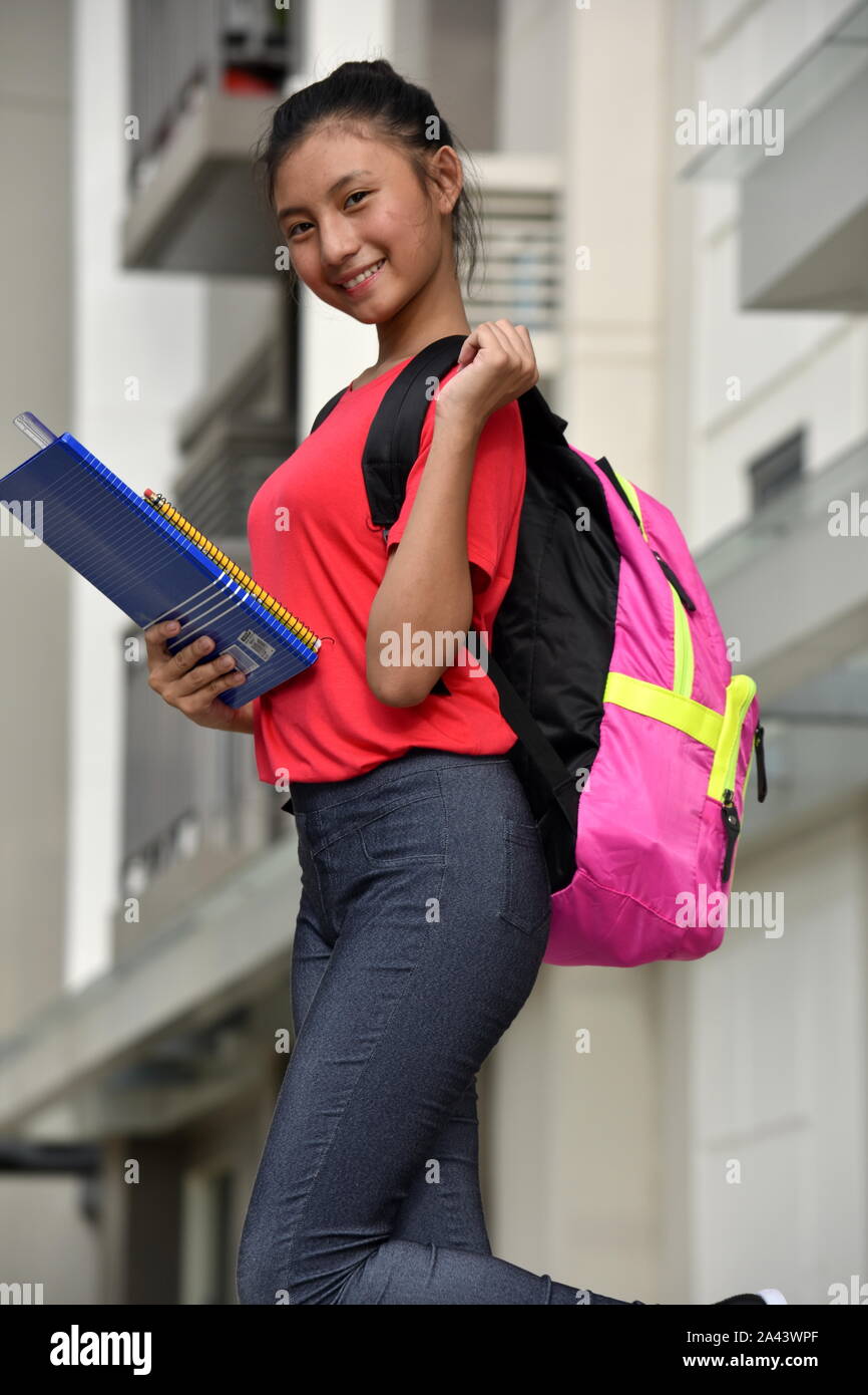 Happy Cute Girl Student With Books Stock Photo - Alamy