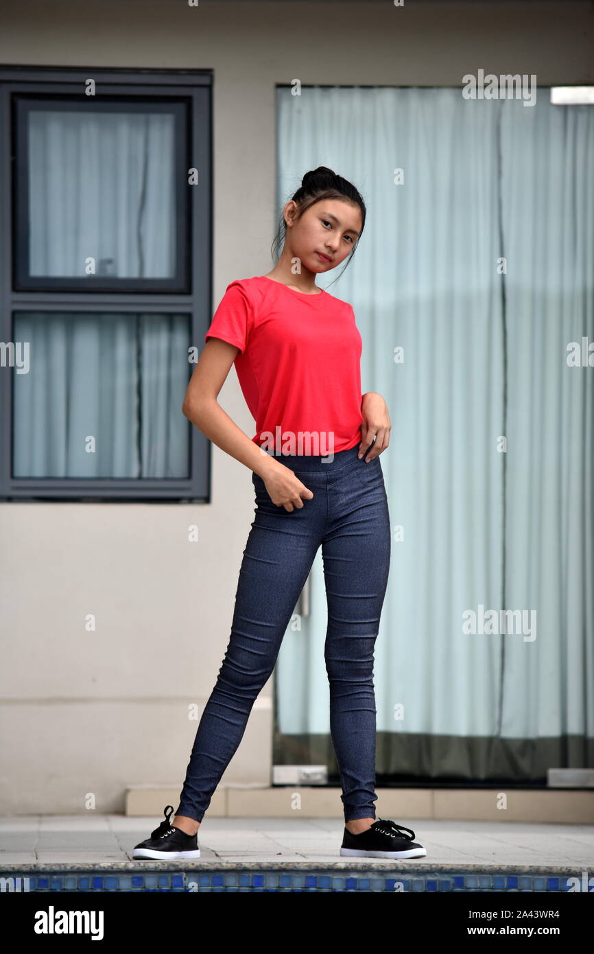 Serious Teenager Girl Standing Stock Photo - Alamy