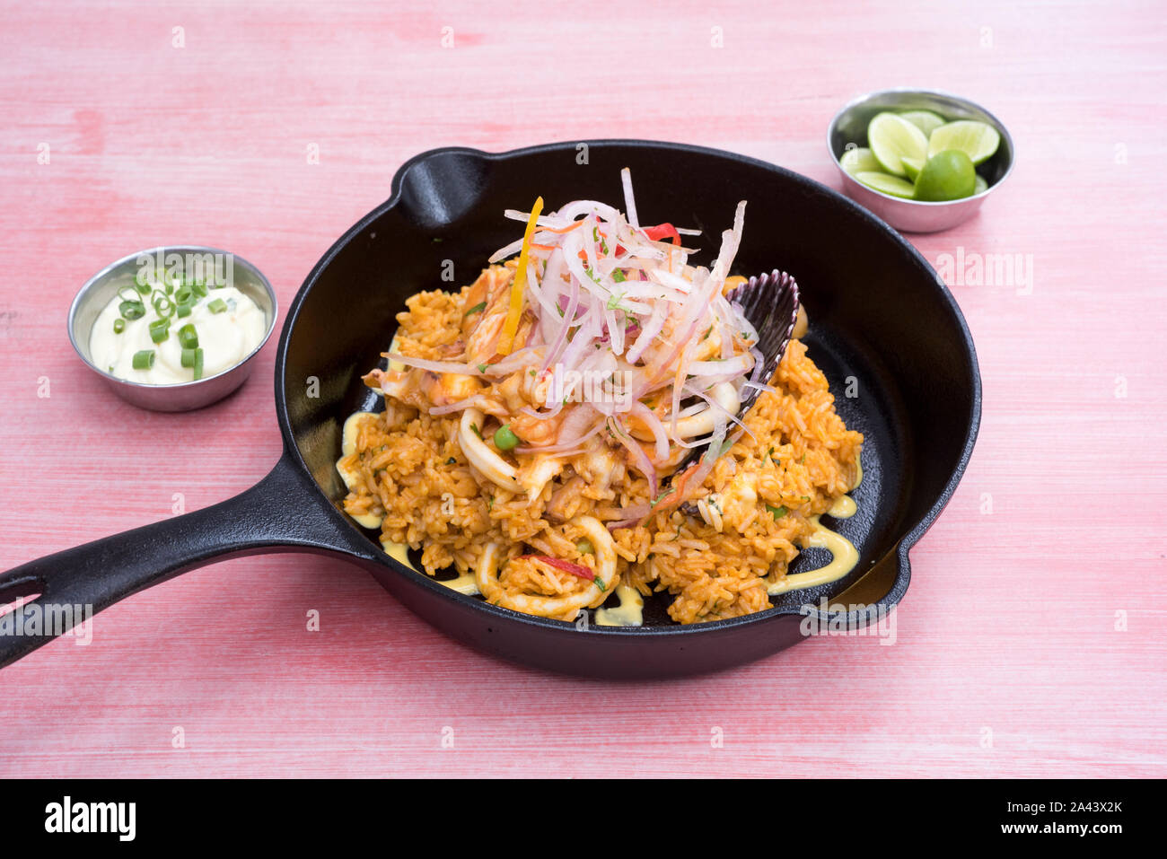 rice with seafood. Typical food of Peruvian cuisine. Yellow Stock Photo ...