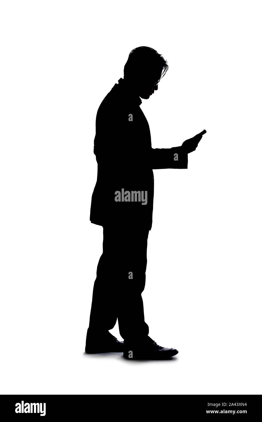Full body silhouette of a businessman isolated on a white background ...