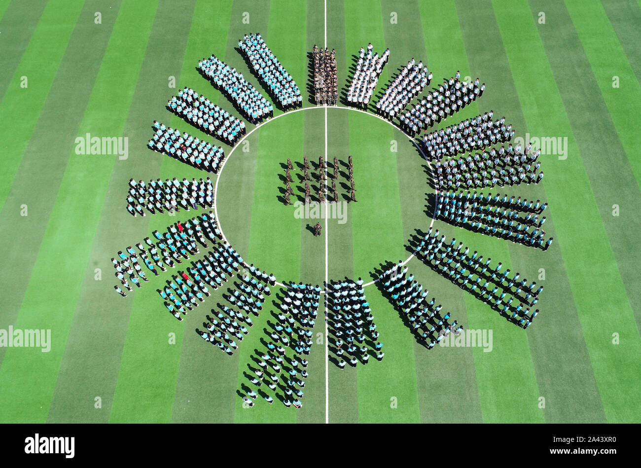 Chinese high school students are lined up to form a military training ...