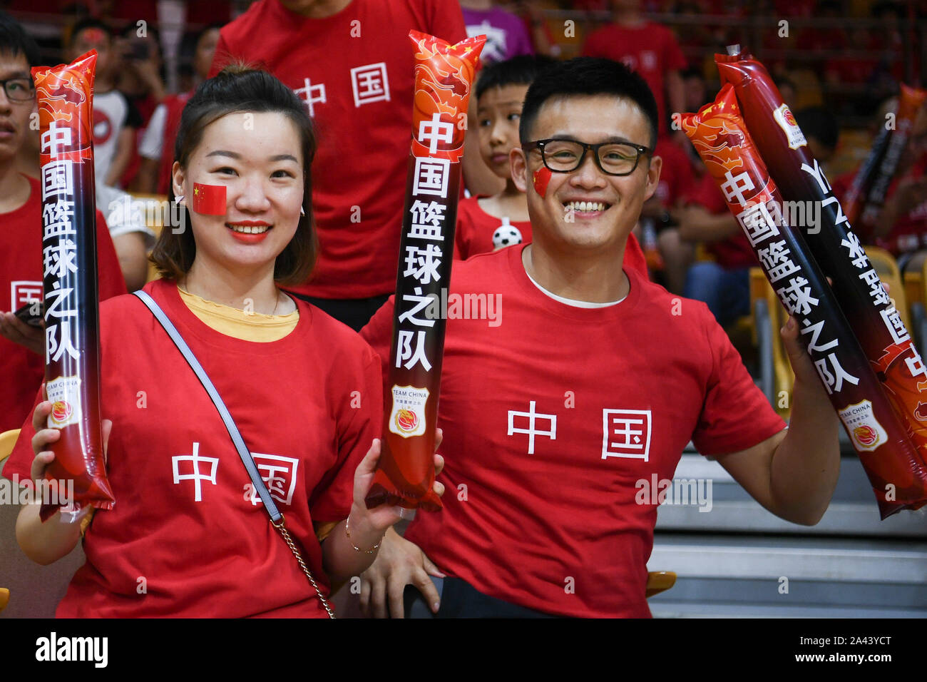 Chinese basketball fans cheer up for the Chinese team at the stand at ...