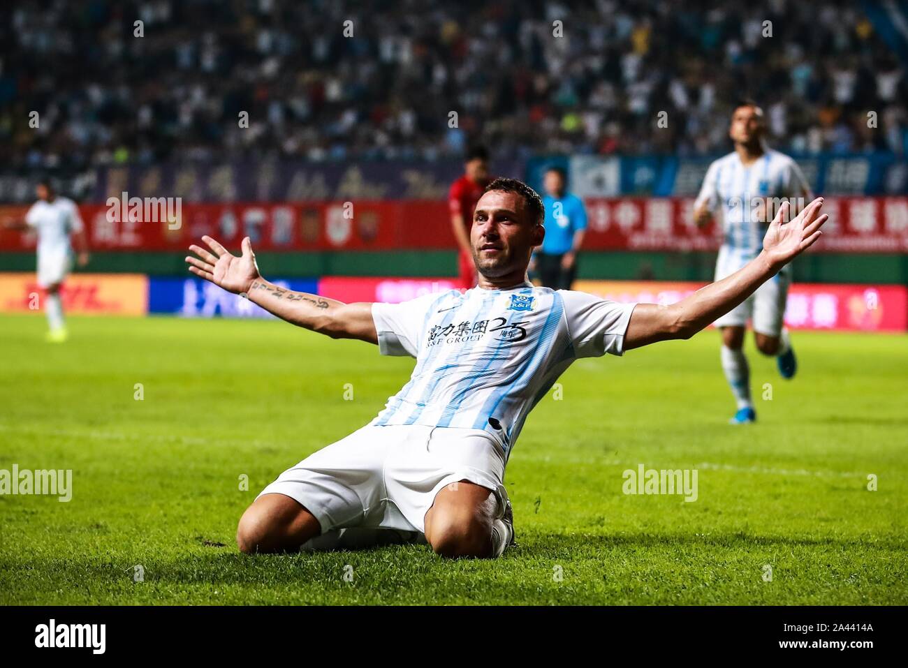 Serbian football player Dusko Tosic of Guangzhou R&F F.C. celebrates ...