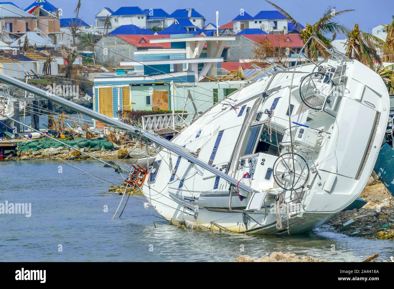 damage boat on a pier on st.maarten Stock Photo - Alamy