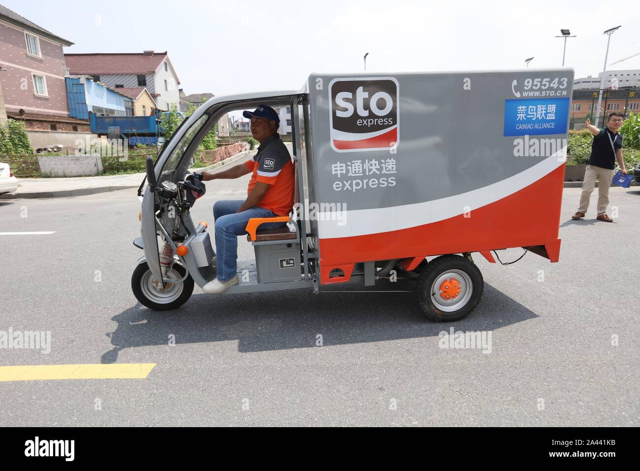 --FILE--Chen Dejun, Chairman of STO Express, drives a delivery vehicle ...