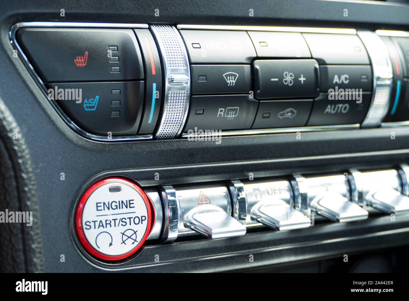 close up view of luxurious car dashboard with push to start button ...