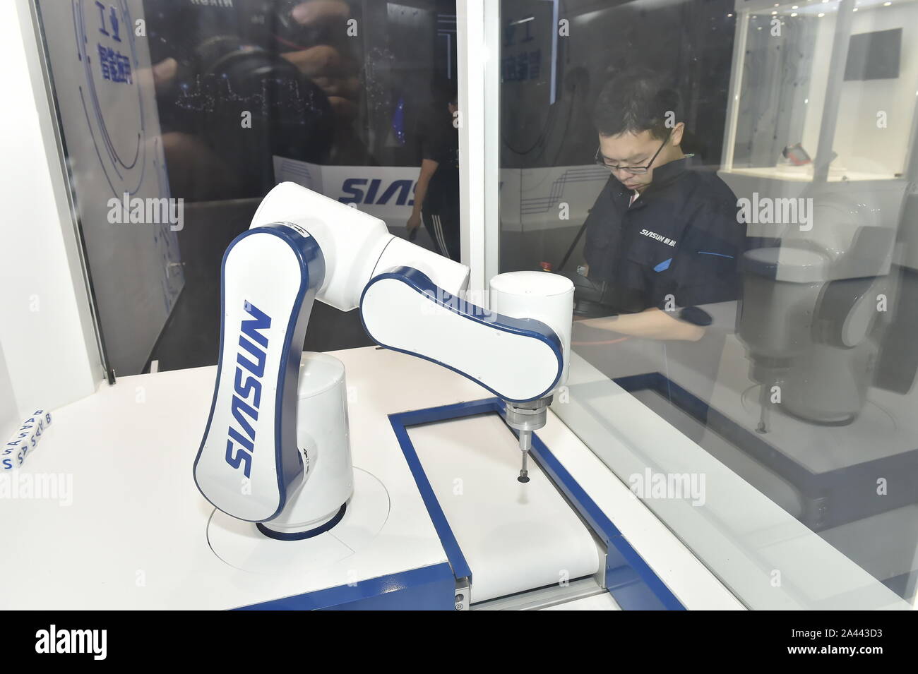 --FILE--A robot arm is displayed at a research center of Siasun Robot ...
