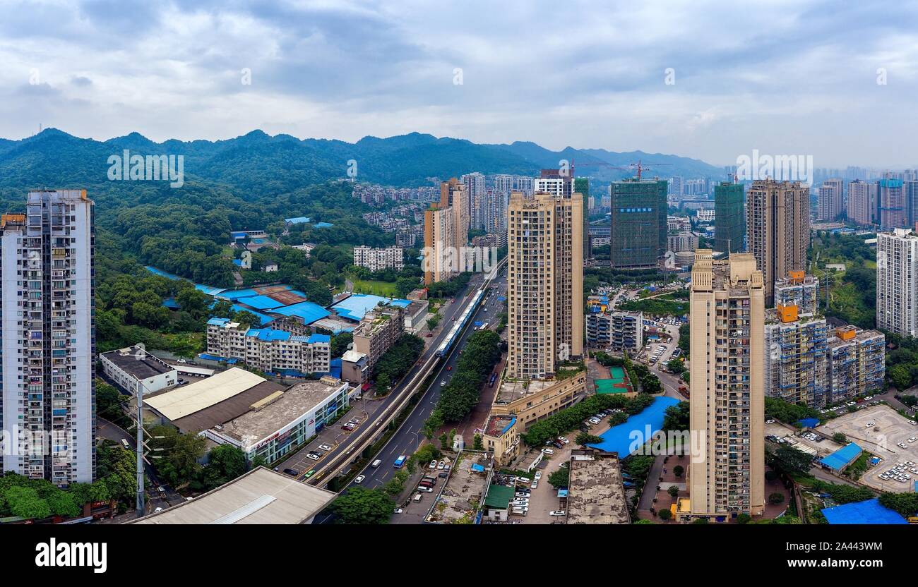 A monorail train of Chongqing Light Rail Line 3 runs in Chongqing ...