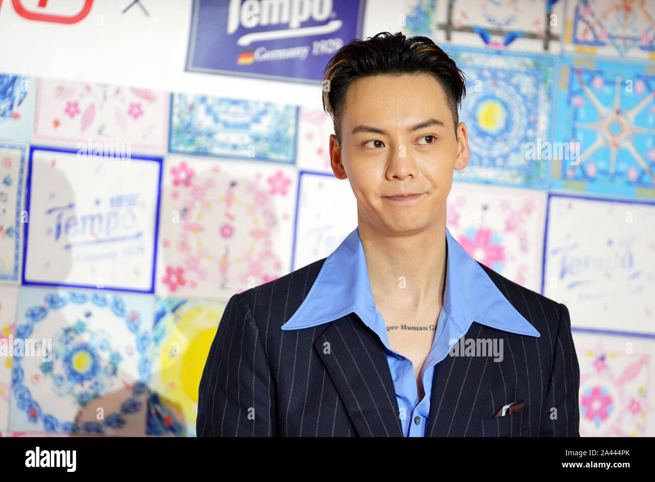 Hong Kong singer and actor William Chan attends a promotional event for ...