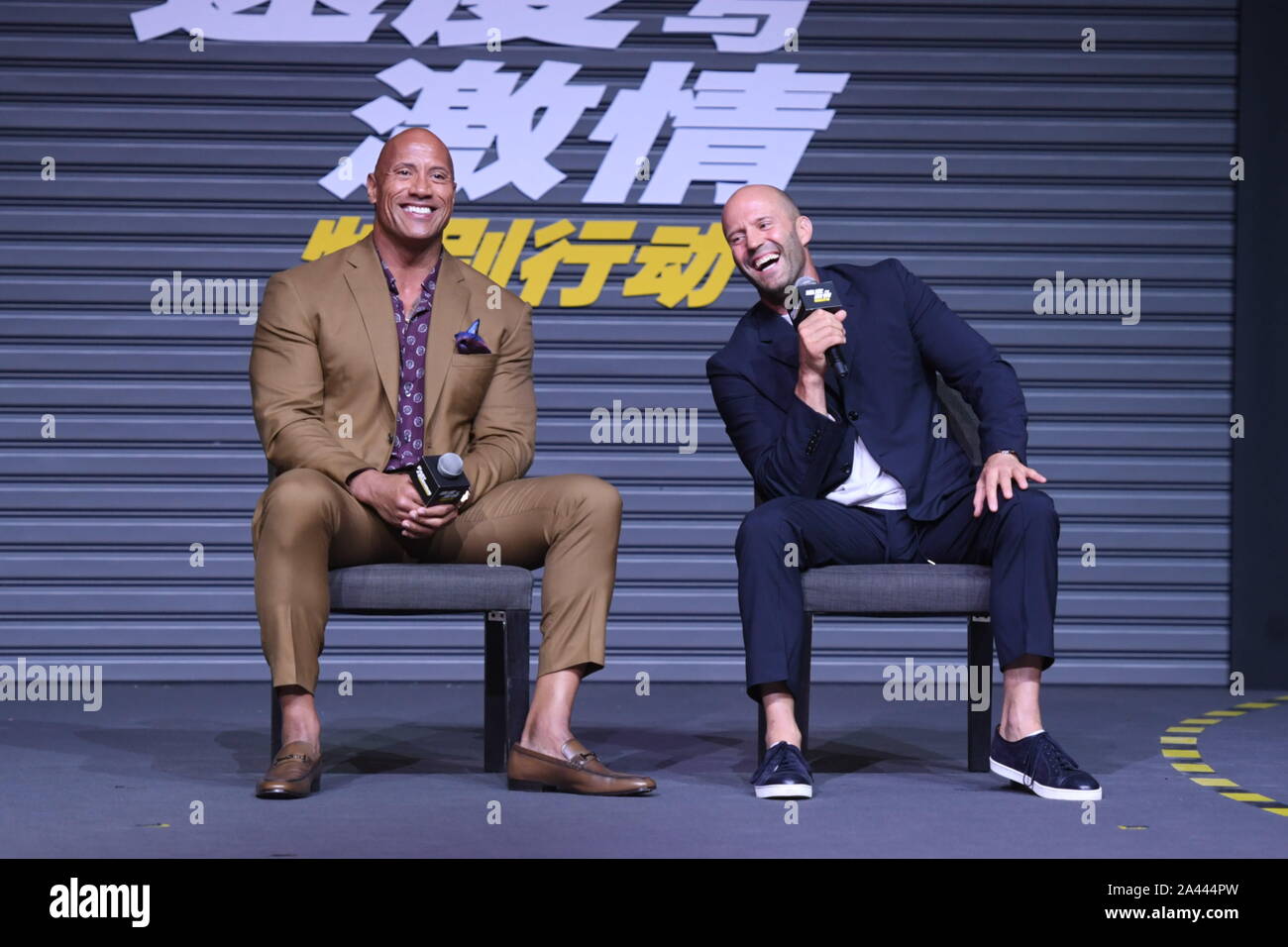 English actor Jason Statham, right, and American actor Dwayne Johnson attend a press conference ...
