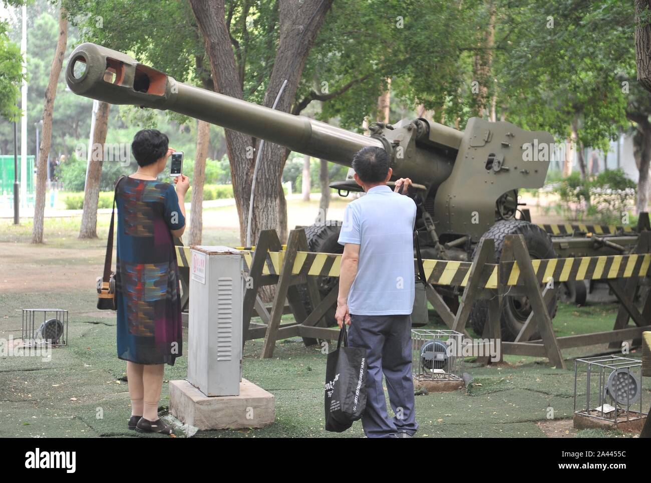 Citizens observe warcraft, tank, machine gun and other army weapons ...