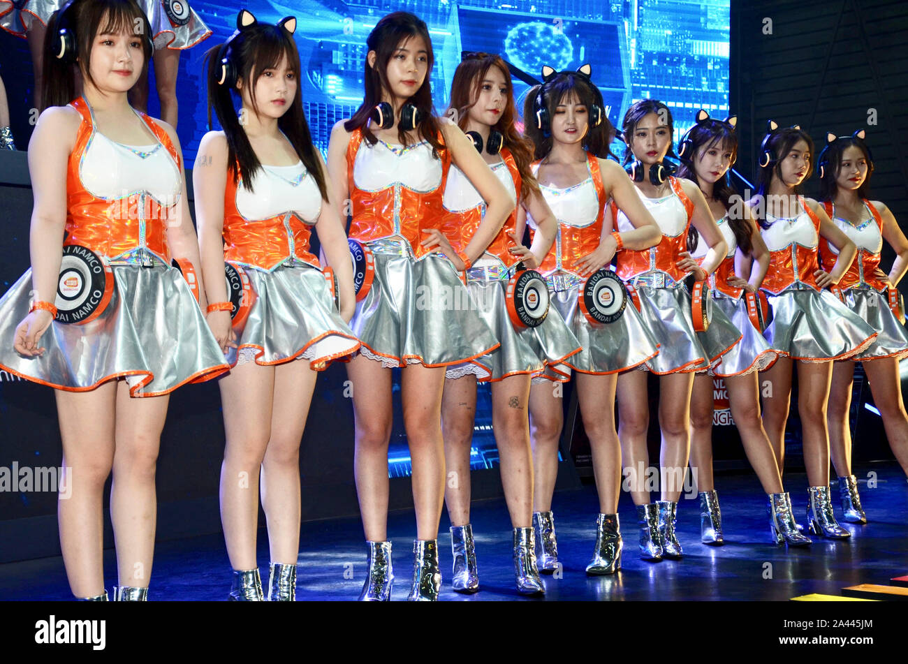 Chinese showgirls pose during a rehearsal ahead of the 17th China Digital Entertainment Expo ...