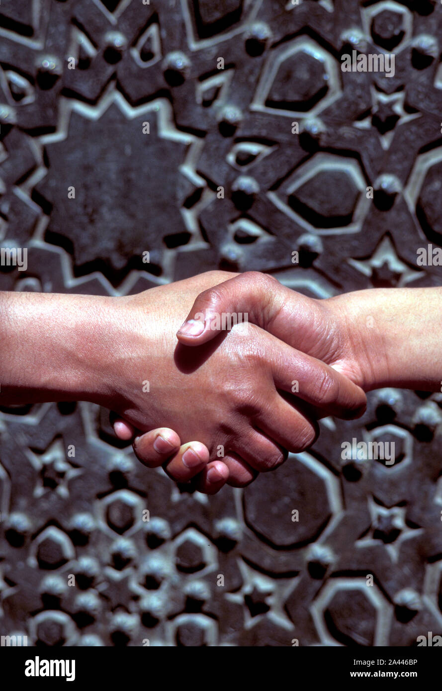 Handshake with Mameluke door, Cairo, Egypt Stock Photo - Alamy