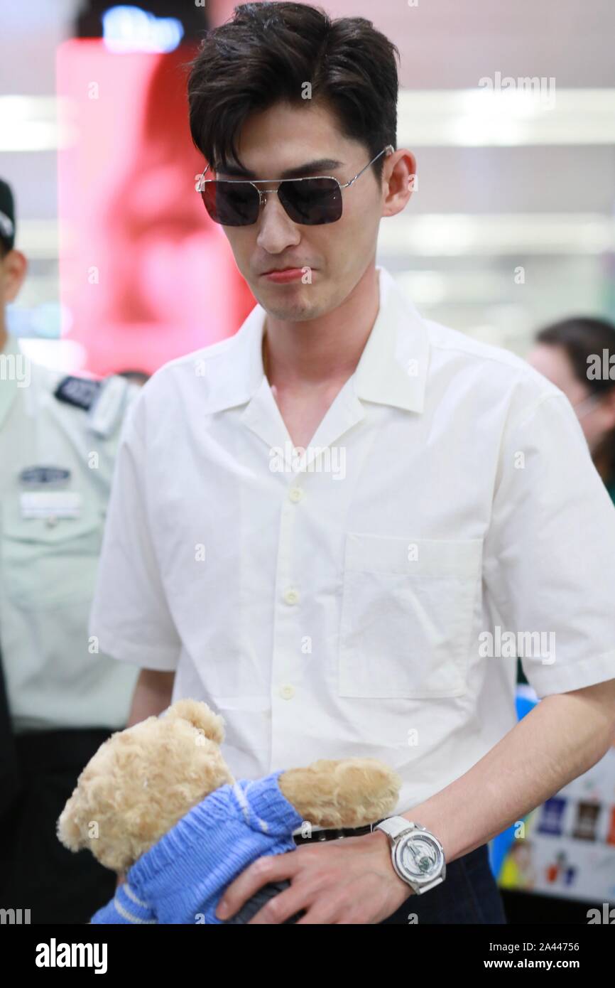 Chinese actor and singer Zhang Han or Hans Zhang arrives at an airport ...