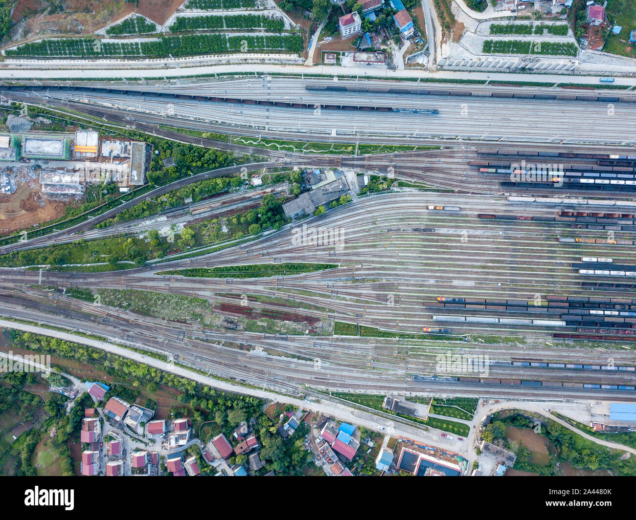 An aerial view of railway trains parked at a classification yard or ...