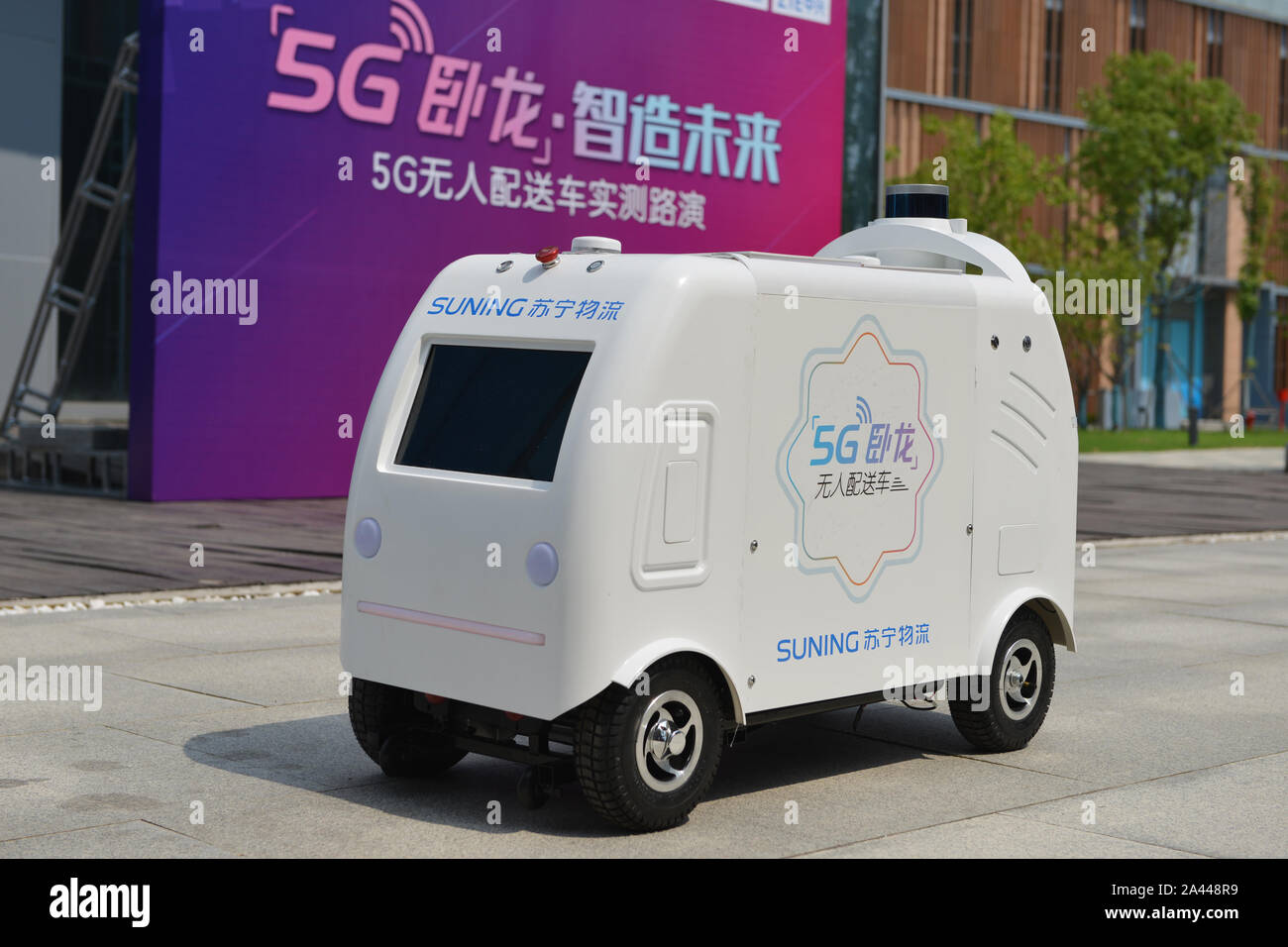 An unmanned delivery vehicle supported by 5G networks is seen during a ...