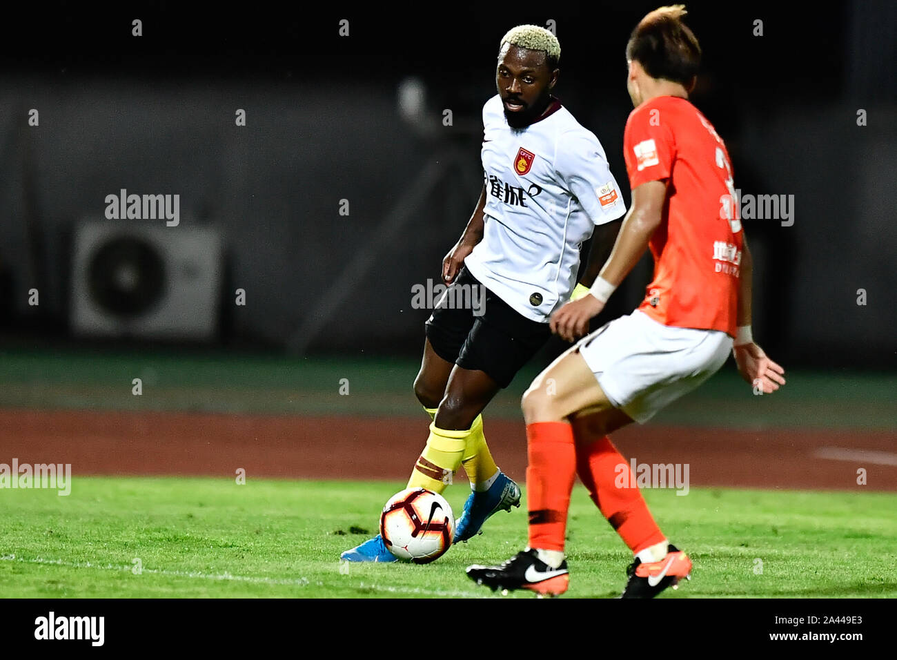 Brazilian football player Fernando Henrique, left, of Hebei China ...