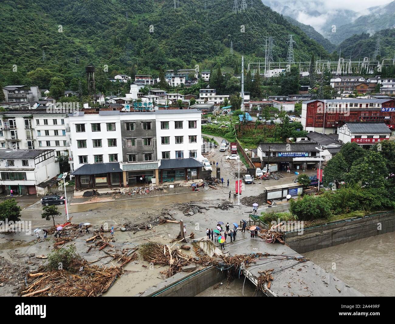 Roads, fields and residential buildings are covered with mud and ...