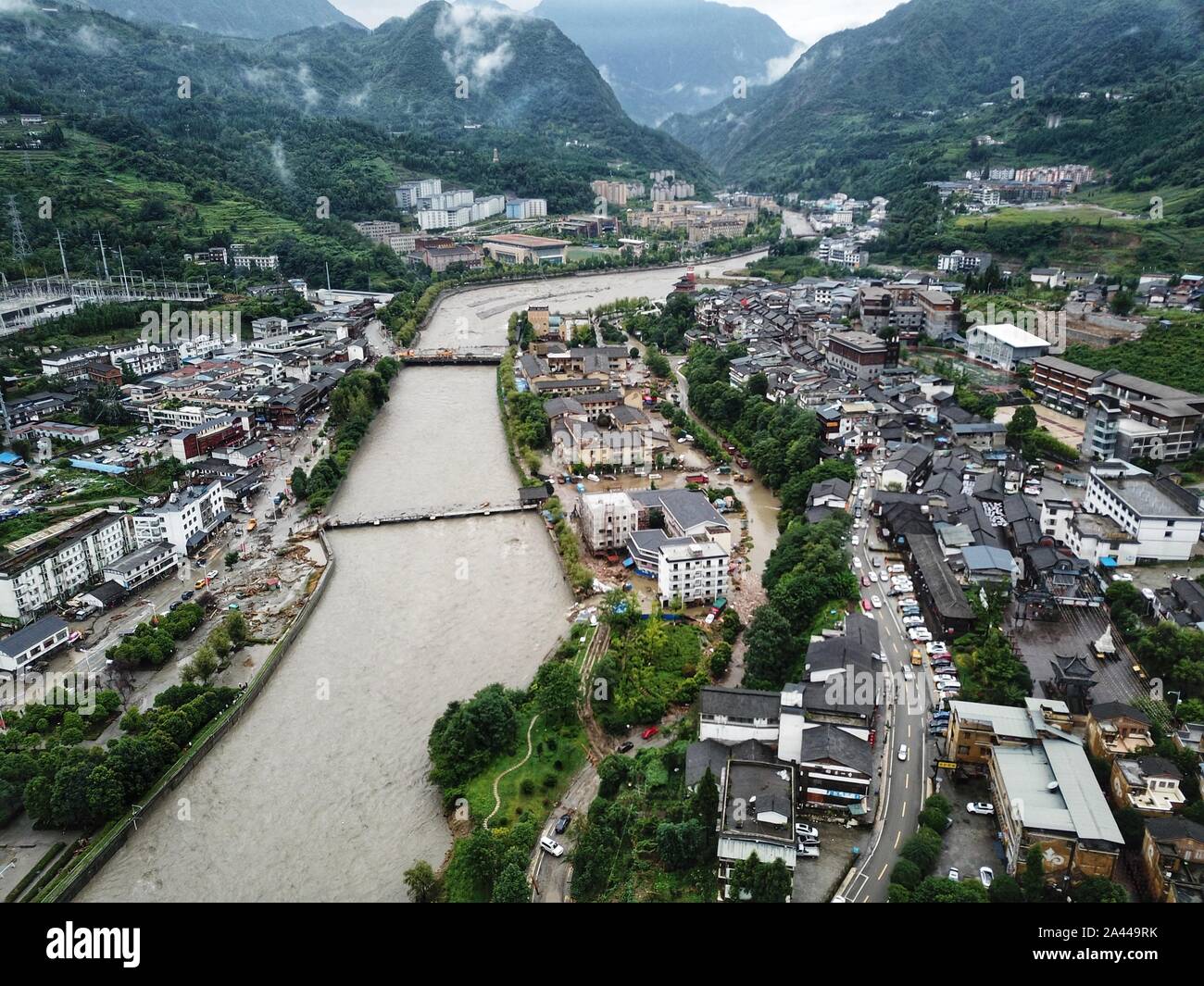 Roads, fields and residential buildings are covered with mud and ...