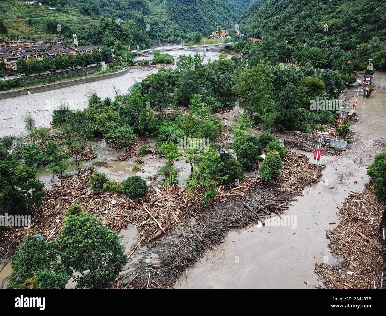 Roads, fields and residential buildings are covered with mud and ...