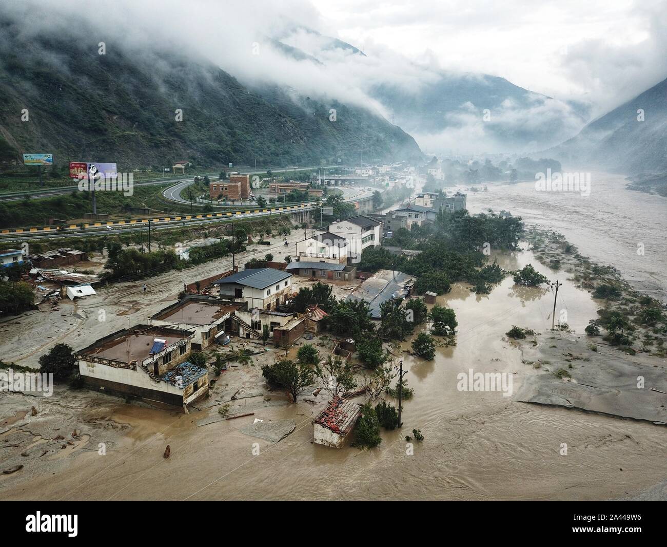 Roads and residential buildings are devastated by multiple mudslides ...