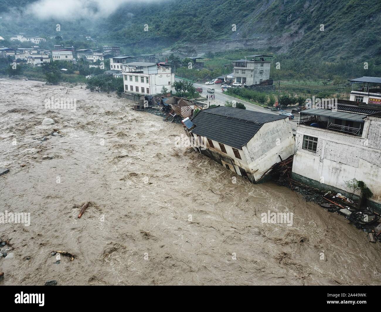 Roads and residential buildings are devastated by multiple mudslides ...