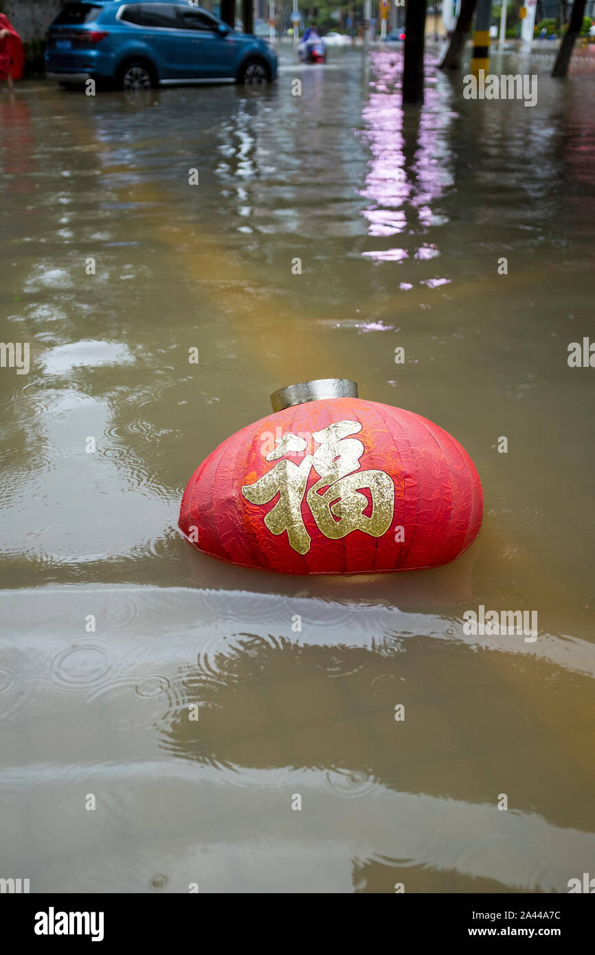 A road is submerged by floodwater after a heavy rainstorm caused by ...