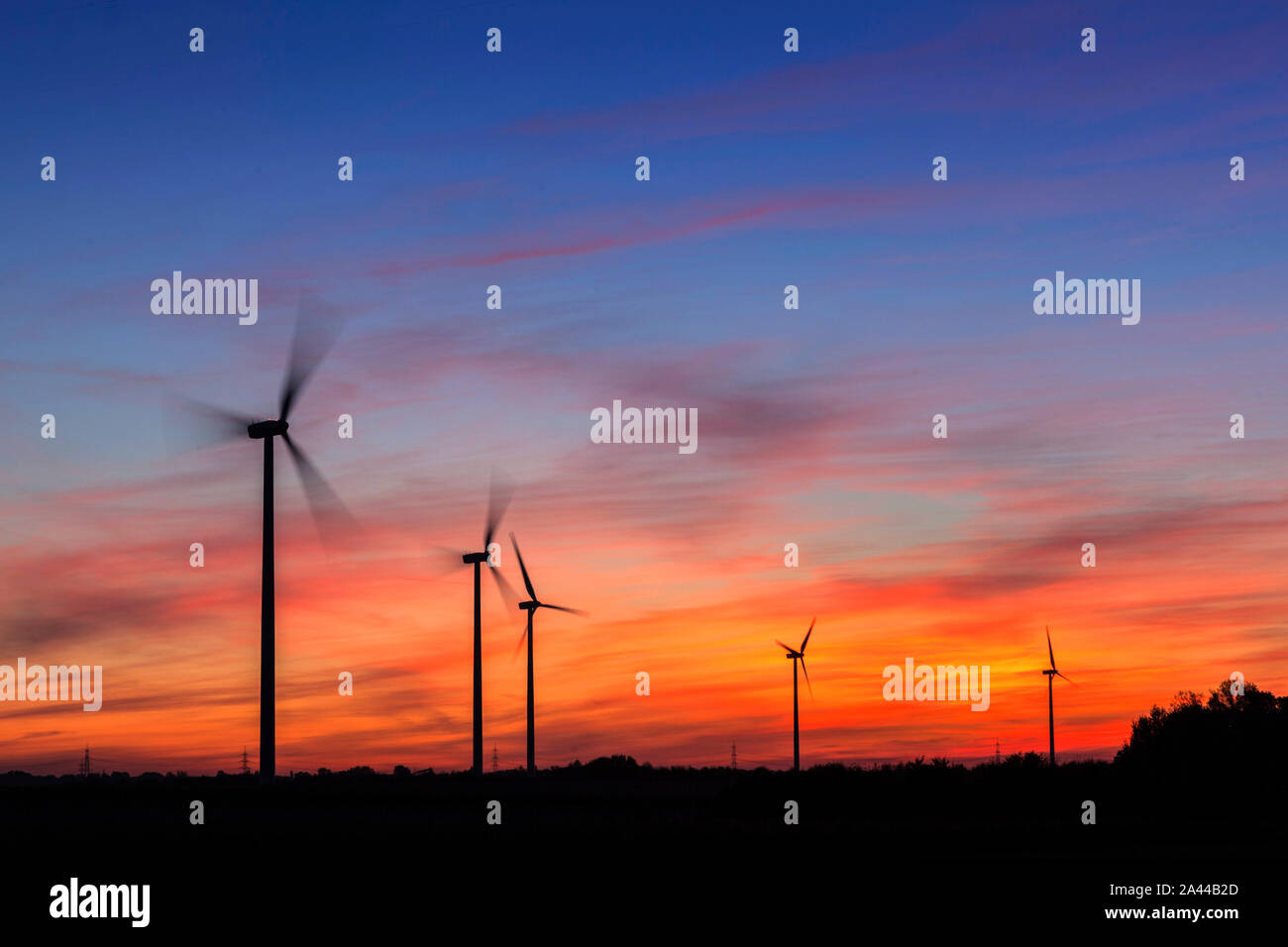 Wind turbine in the sunrise Stock Photo - Alamy