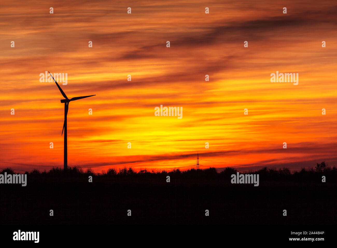 Wind turbine in the sunrise Stock Photo - Alamy