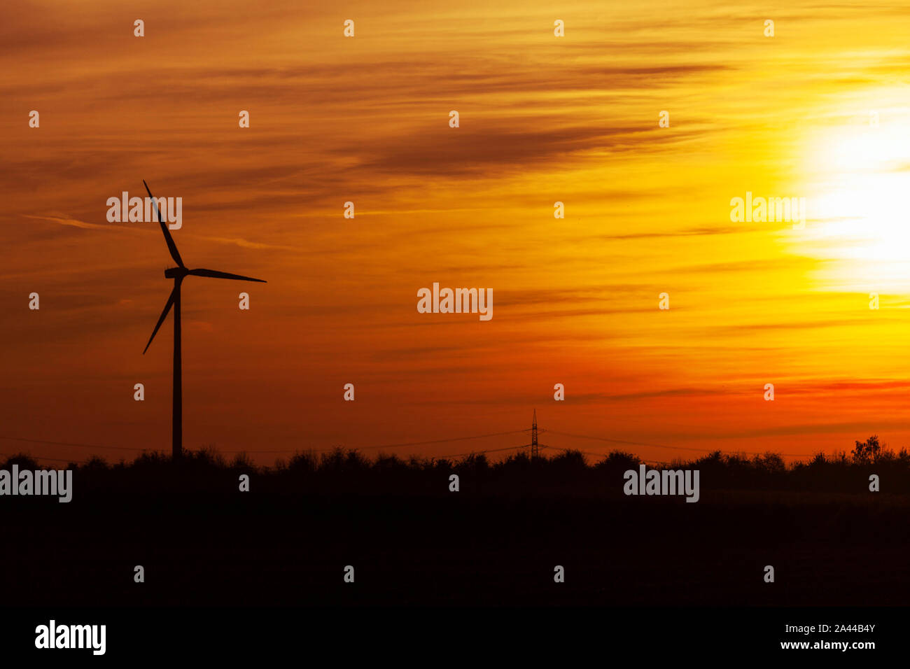 Wind turbine in the sunrise Stock Photo - Alamy