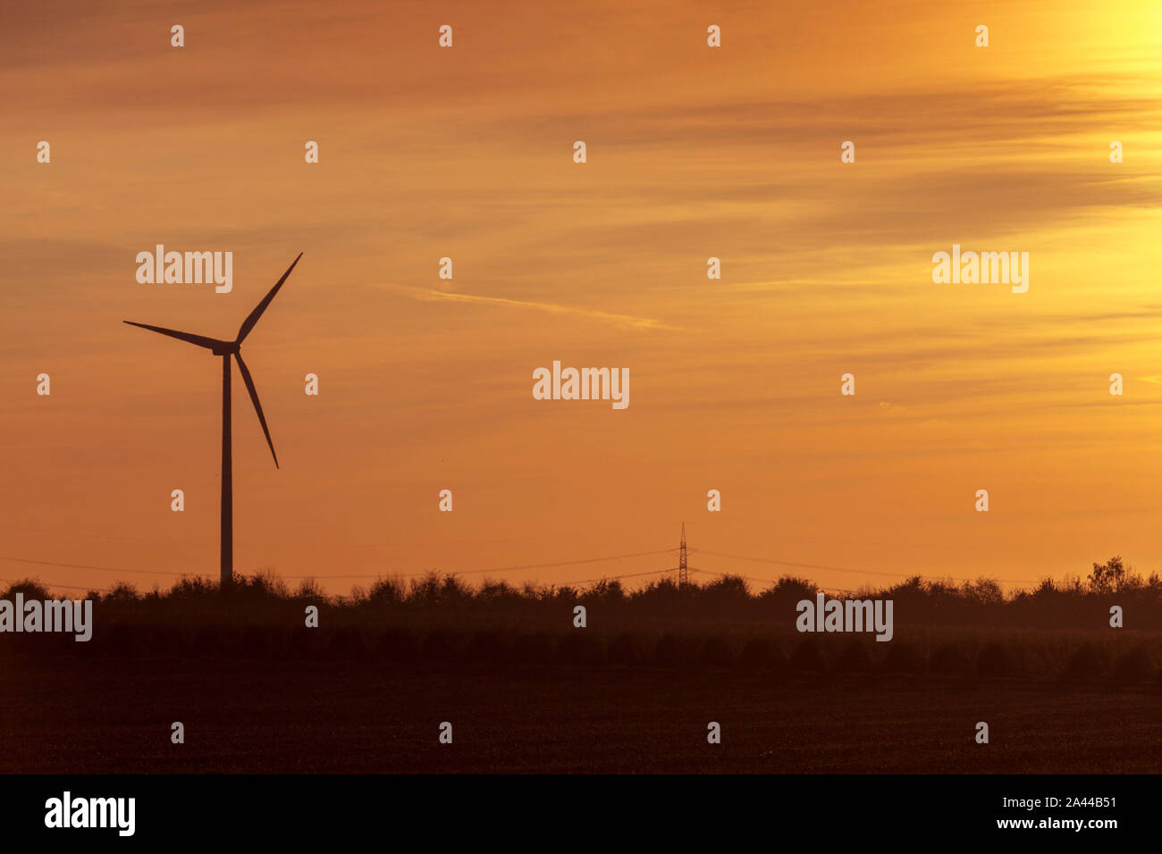 Wind turbine in the sunrise Stock Photo - Alamy
