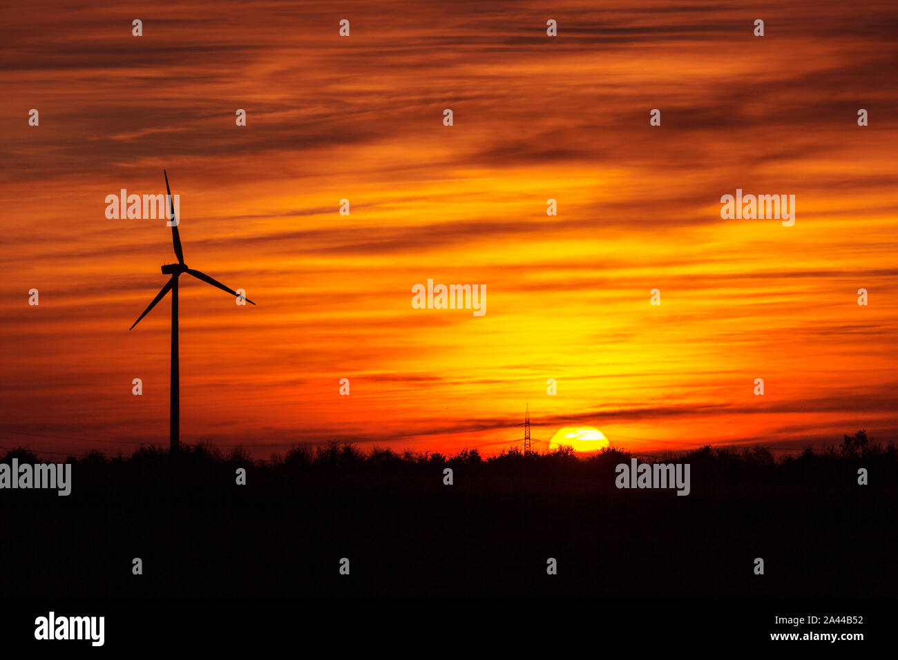 Wind turbine in the sunrise Stock Photo - Alamy