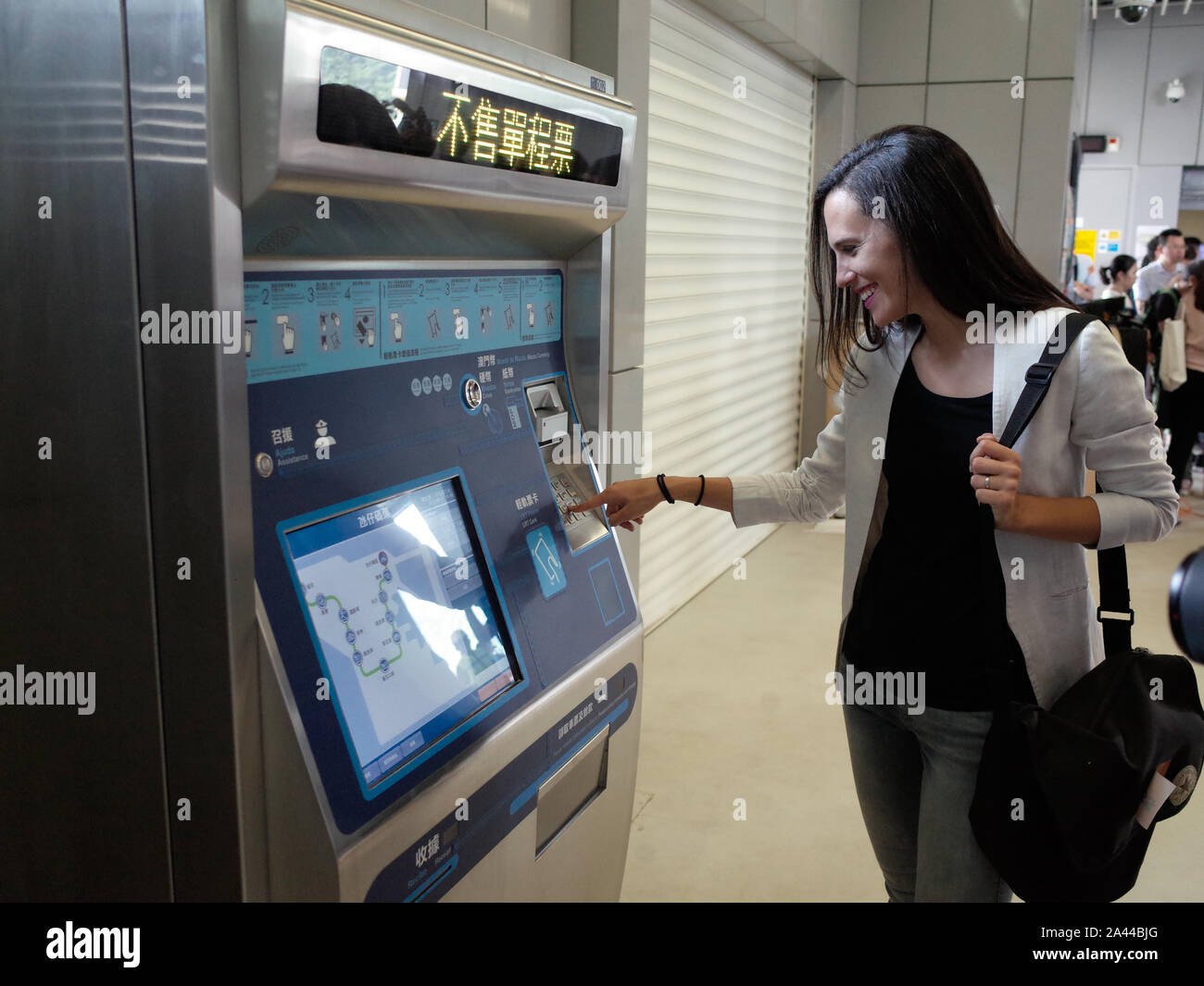 Chinese workers introduce the Light Rail Transit (LRT) system at the ...