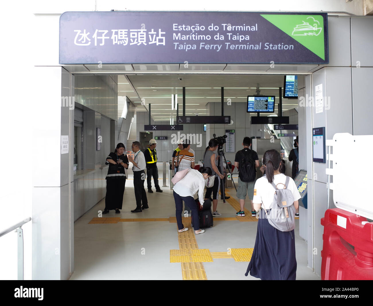 Chinese workers introduce the Light Rail Transit (LRT) system at the ...